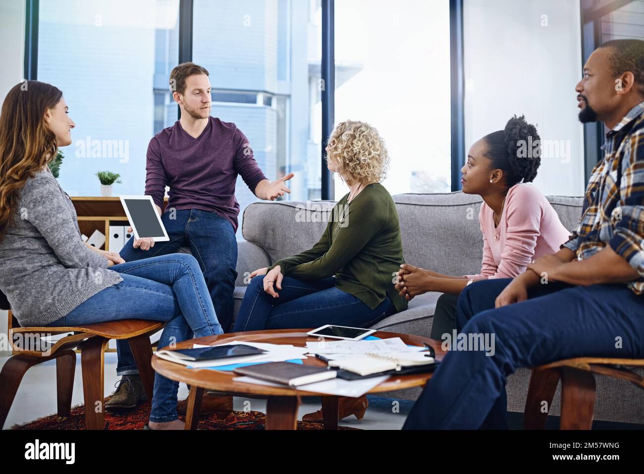 Hes got a bright idea to propose to the team. a team of designers ...