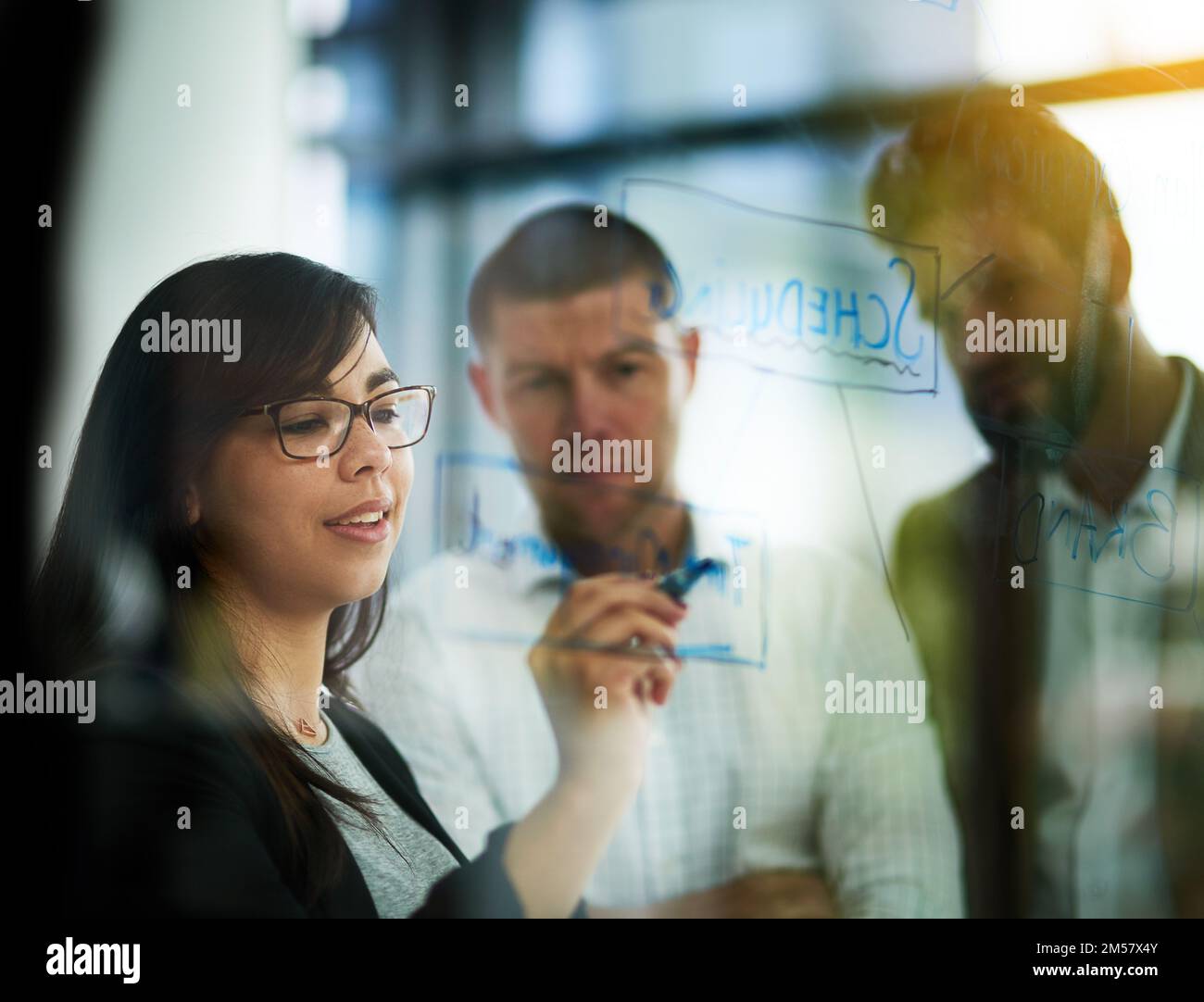 Coming up with a solution together. a group of colleagues brainstorming ...
