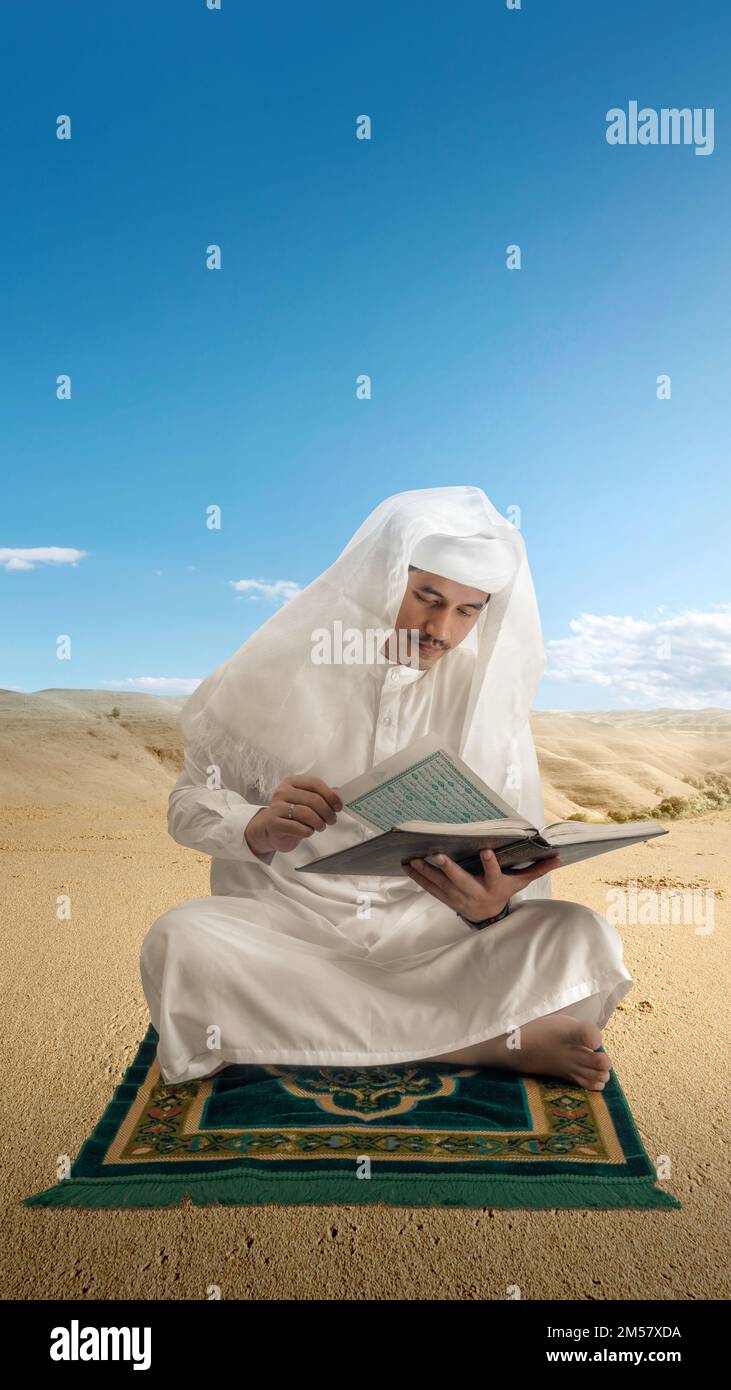 Muslim man sitting in prayer hi-res stock photography and images - Alamy
