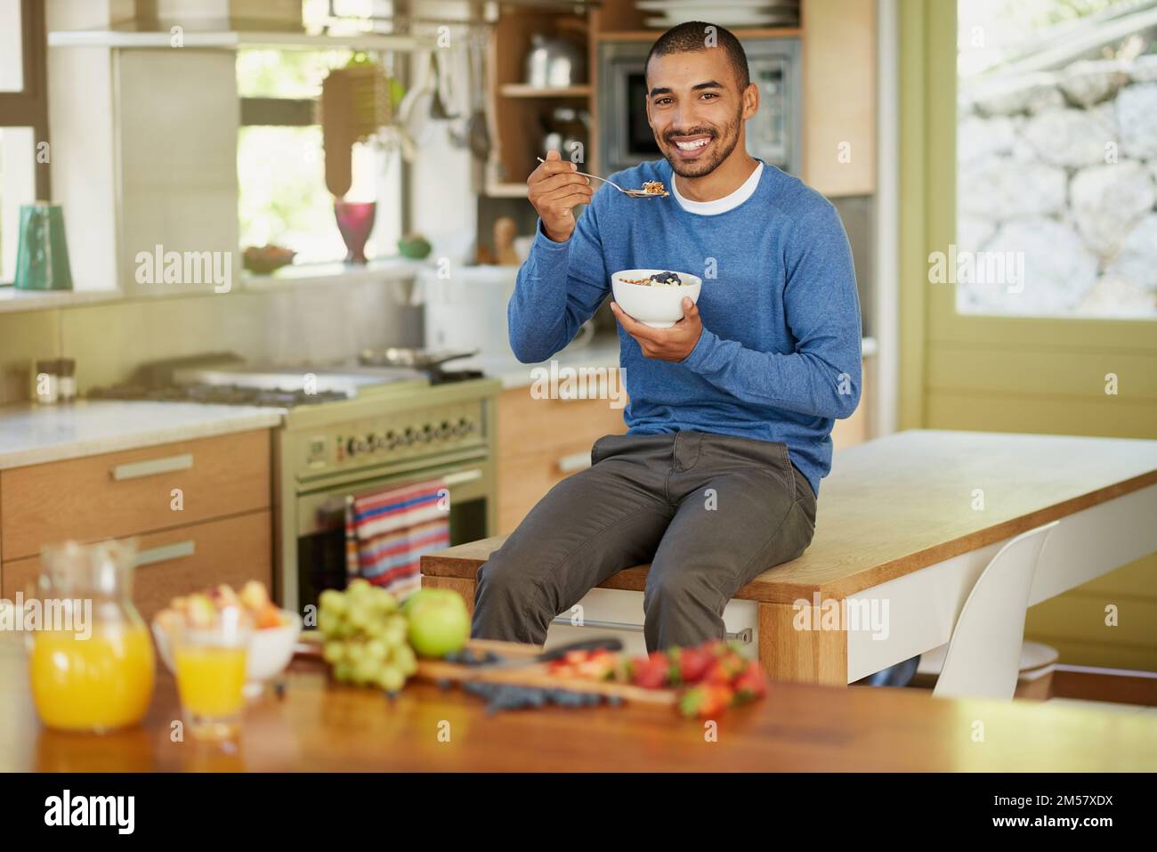 Make the healthy choice every morning. Portrait of a happy young man ...