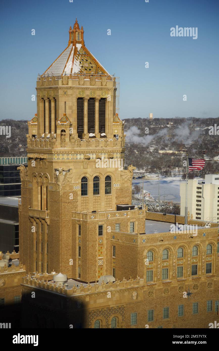 A vertical shot of the Plummer Building surrounded by the snow and ills ...