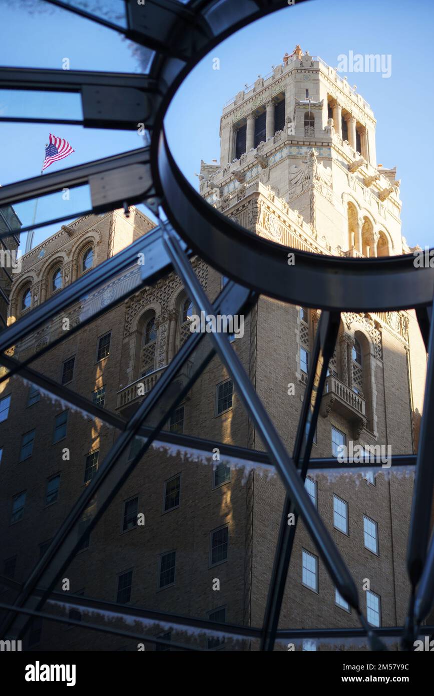 A vertical shot of the Plummer Building covered in the snow in the ...