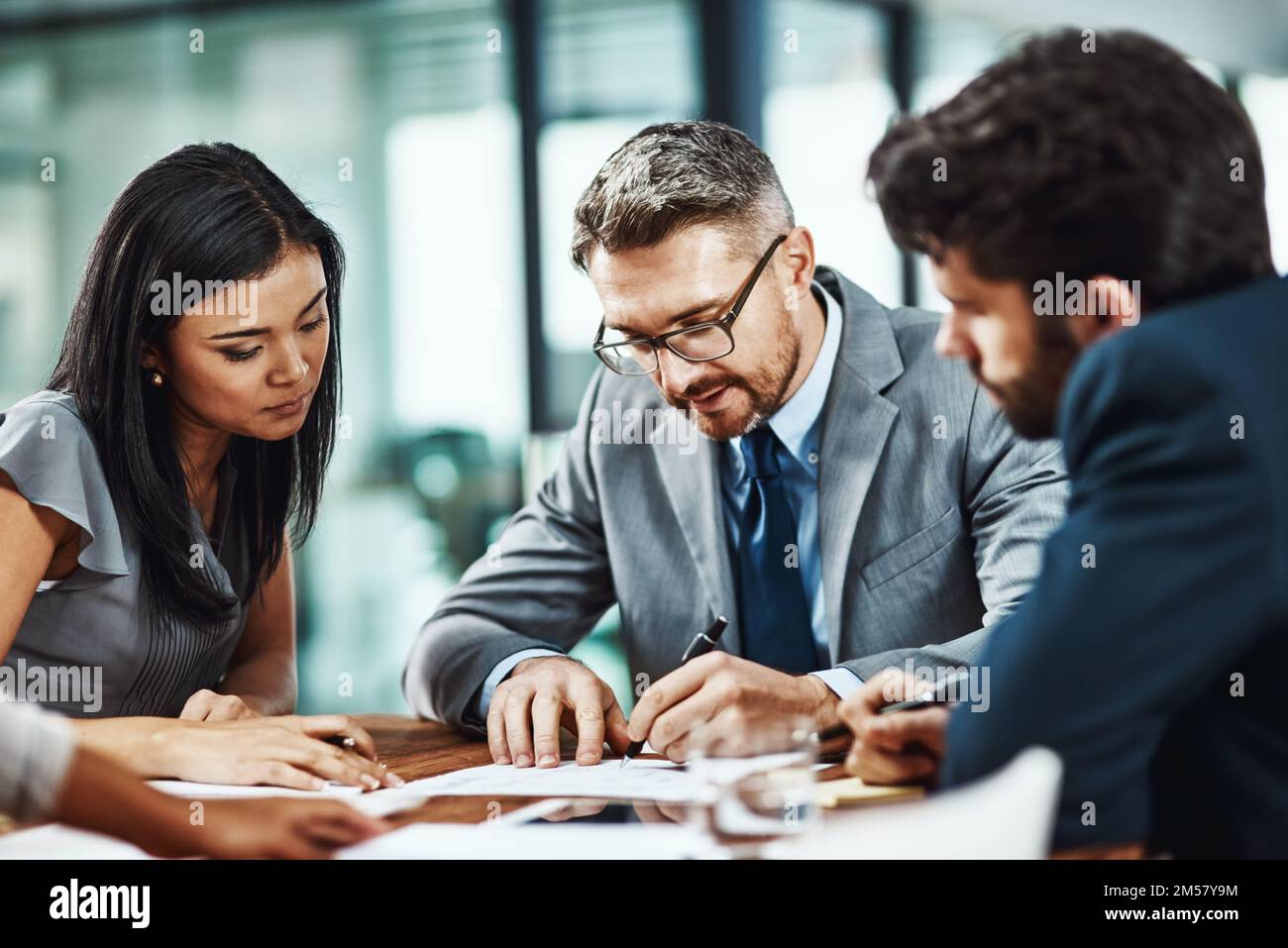 Putting productivity in focus. a group of colleagues having a meeting ...