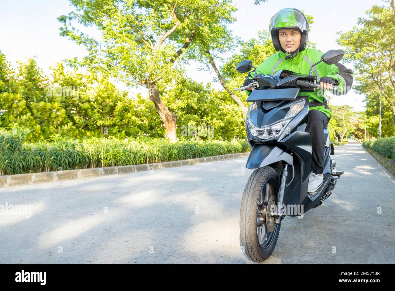 Asian woman works as a motorcycle taxi driver on the street Stock Photo ...