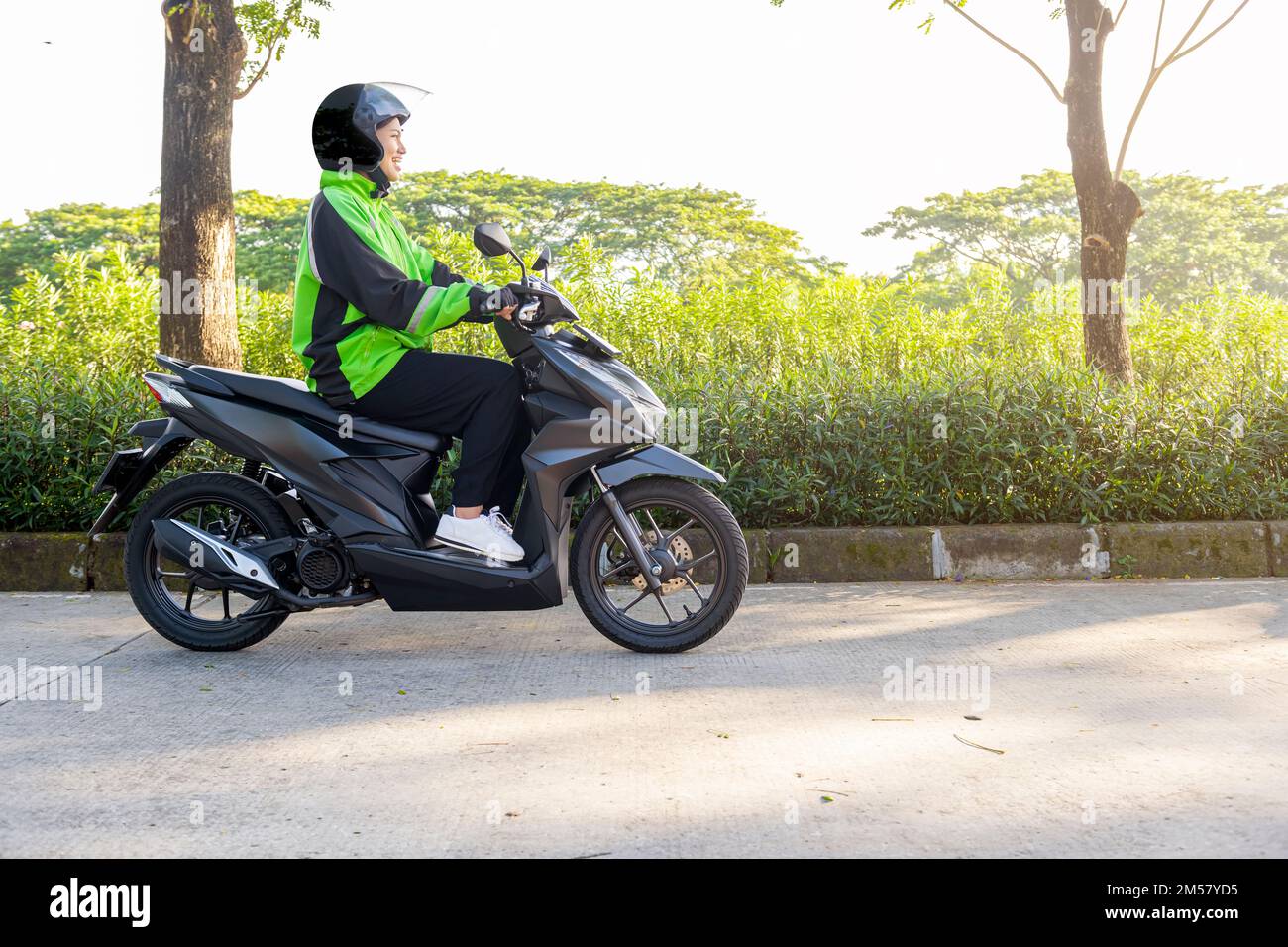 Asian woman works as a motorcycle taxi driver on the street Stock Photo ...