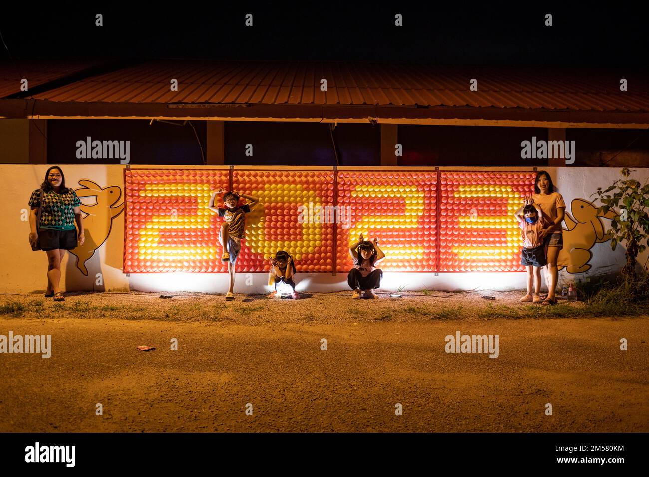 Malacca, Malaysia. 26th Dec, 2022. People pose for photos at a lantern ...