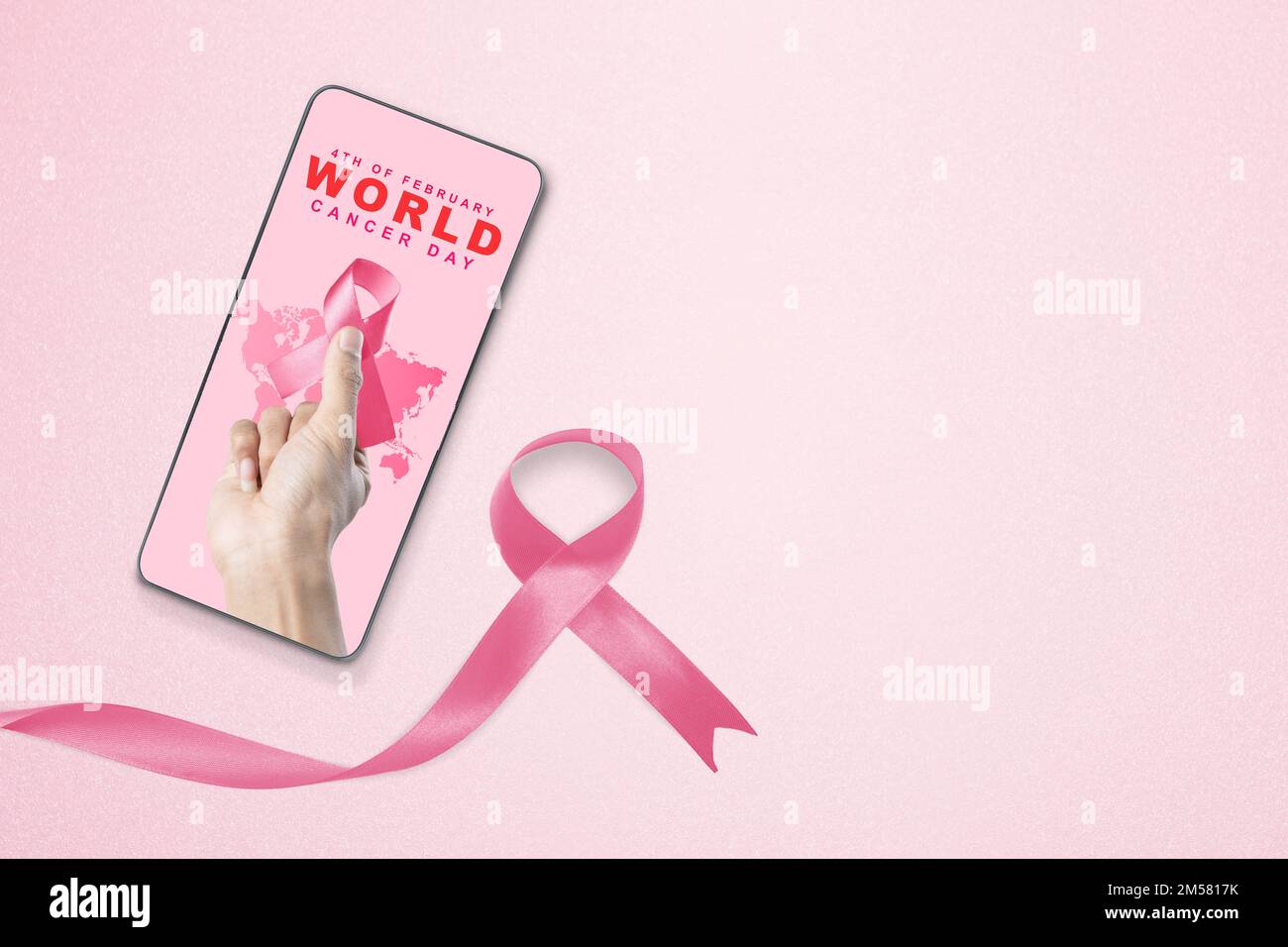 Mobile phone with a screen of a human hand showing purple ribbons ...