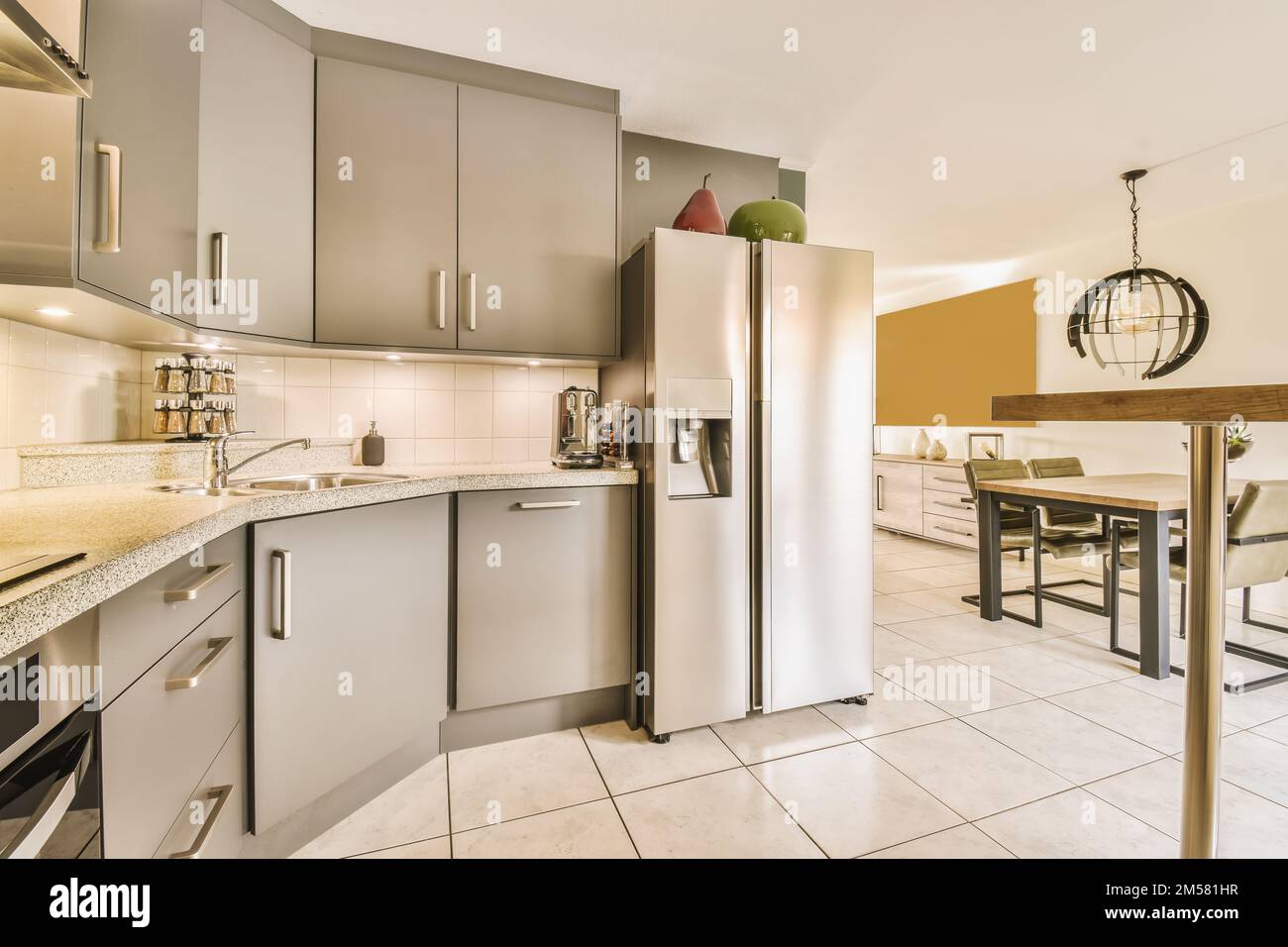 a kitchen and dining area in a small apartment with stainless steel ...