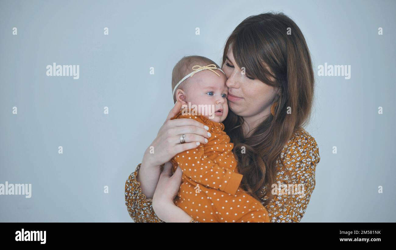 Mother singing lullaby to baby hi-res stock photography and images - Alamy