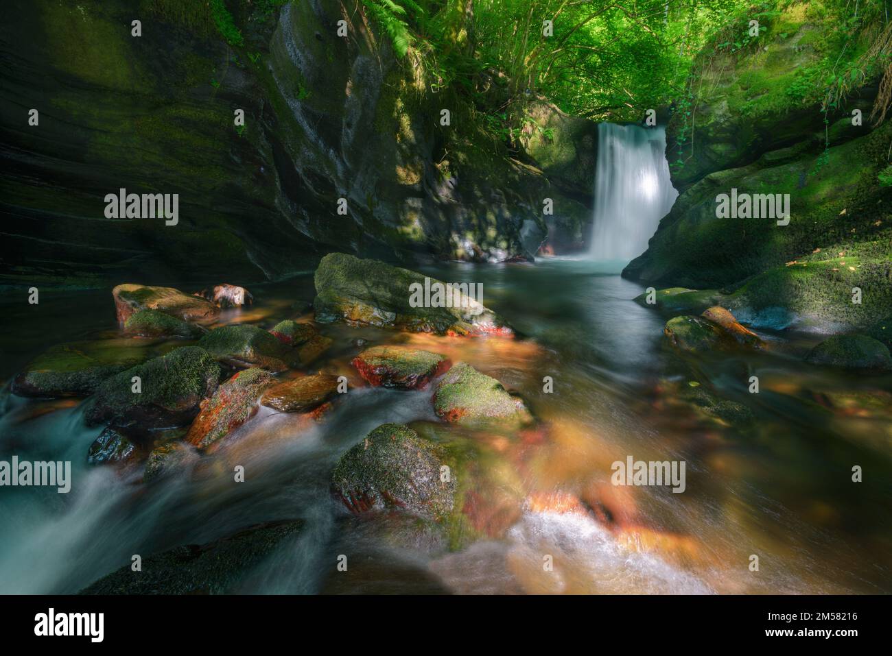 Beautiful limestone gorge with a waterfall in the background in a river ...