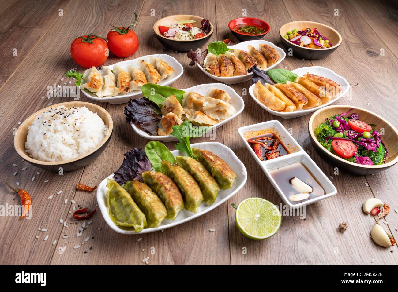 Mixed and tasted asian food on a wooden tablefood Stock Photo - Alamy