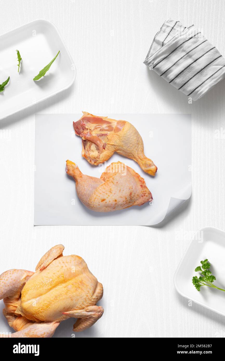 Chicken thighs on a kitchen with some herbs from above Stock Photo - Alamy