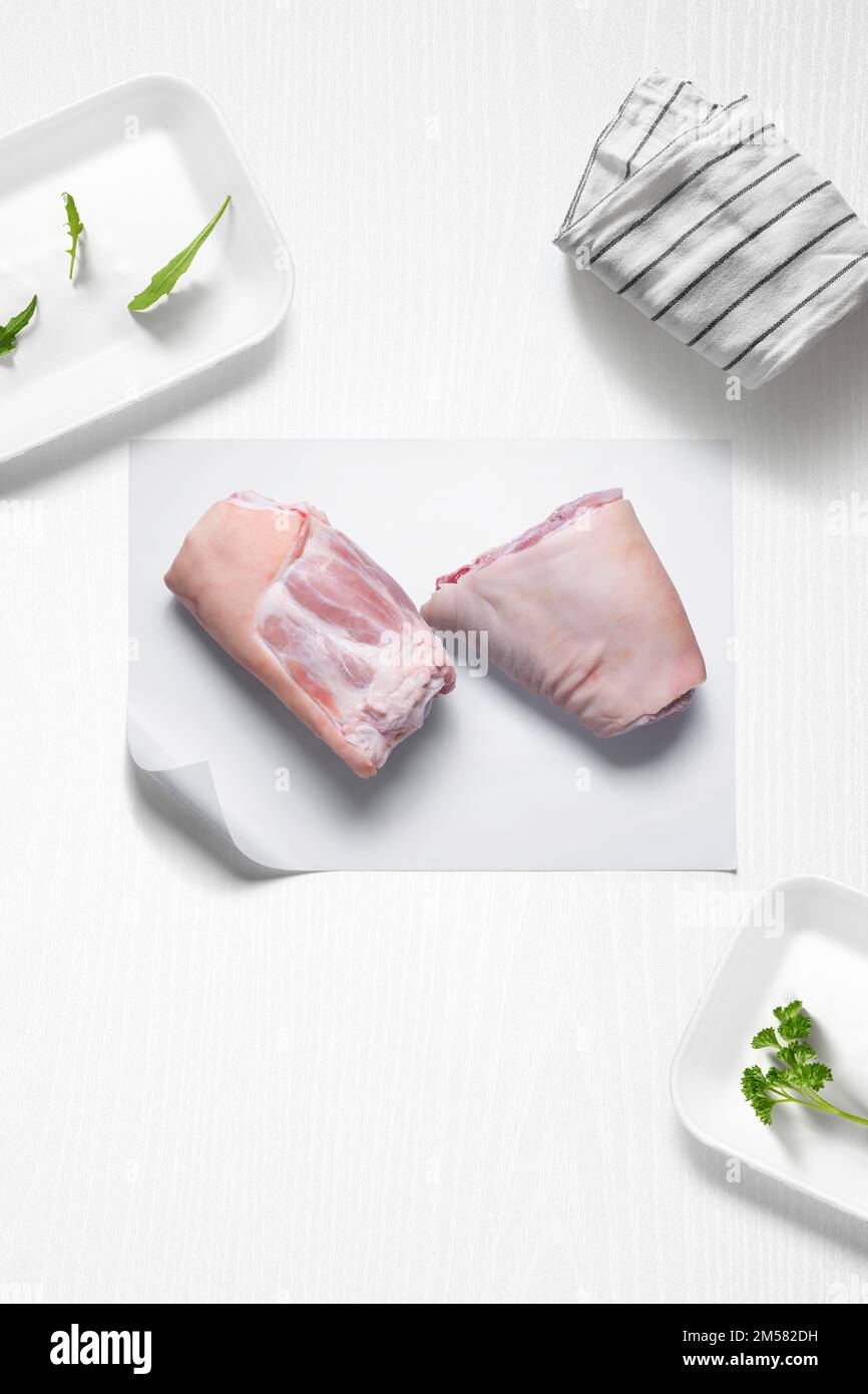 Pork knuckles on a kitchen with some herbs from above Stock Photo - Alamy