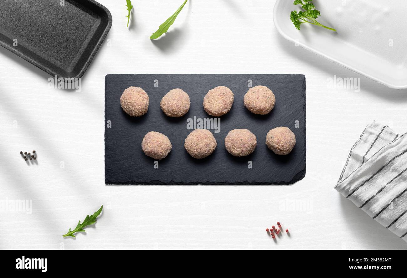 Meatballs on a flat lay of a kitchen with various items from above ...