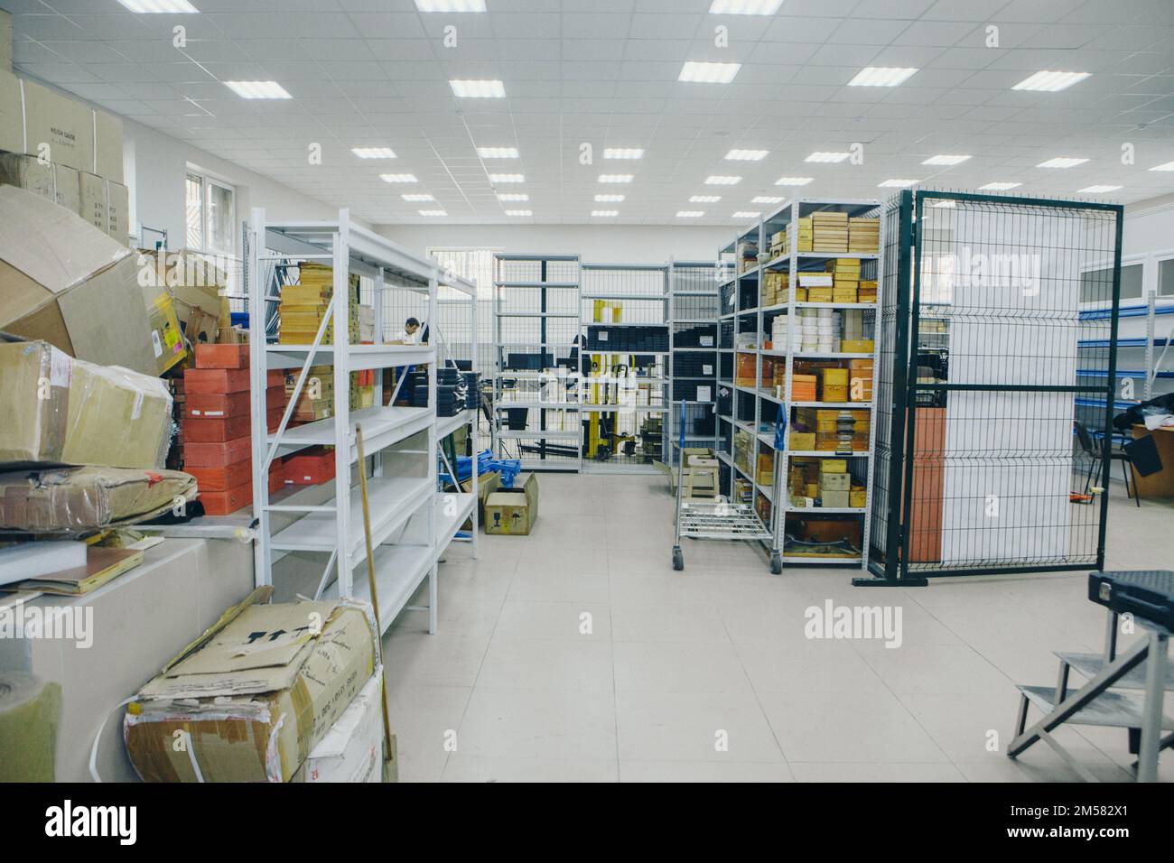 product warehouse in the store. Shelves in the back room. Retail ...