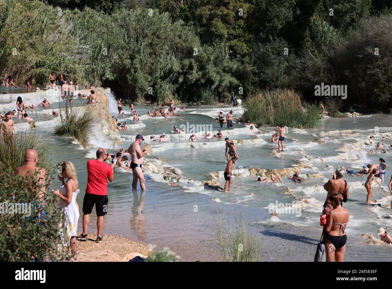 Saturnia, Italy - September 13, 2022: People are bathing in the hot ...