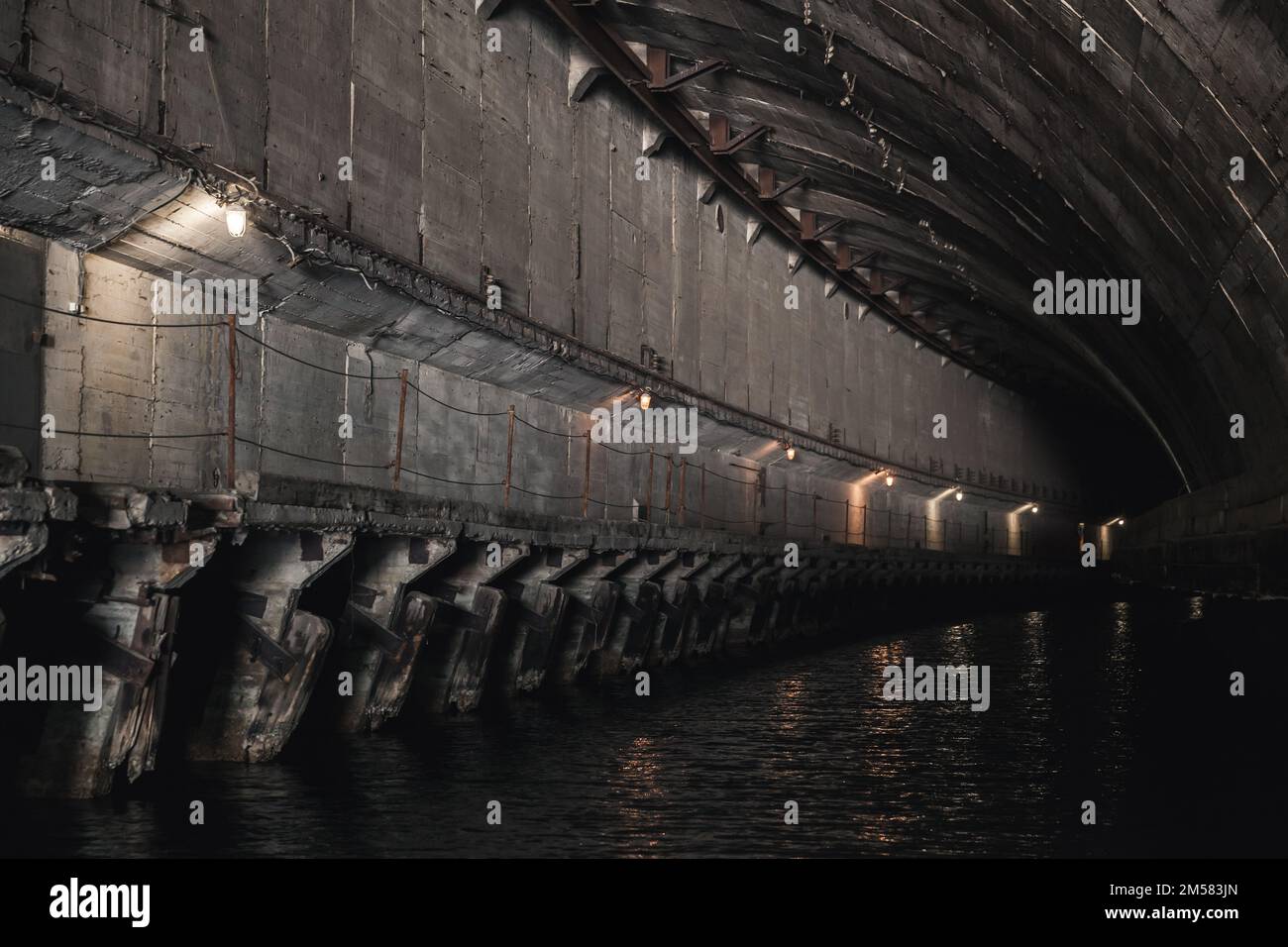 Industrial dark concrete tunnel perspective. Aandoned underground ...