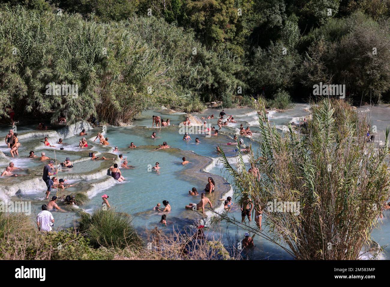Saturnia, Italy - September 13, 2022: People are bathing in the hot ...