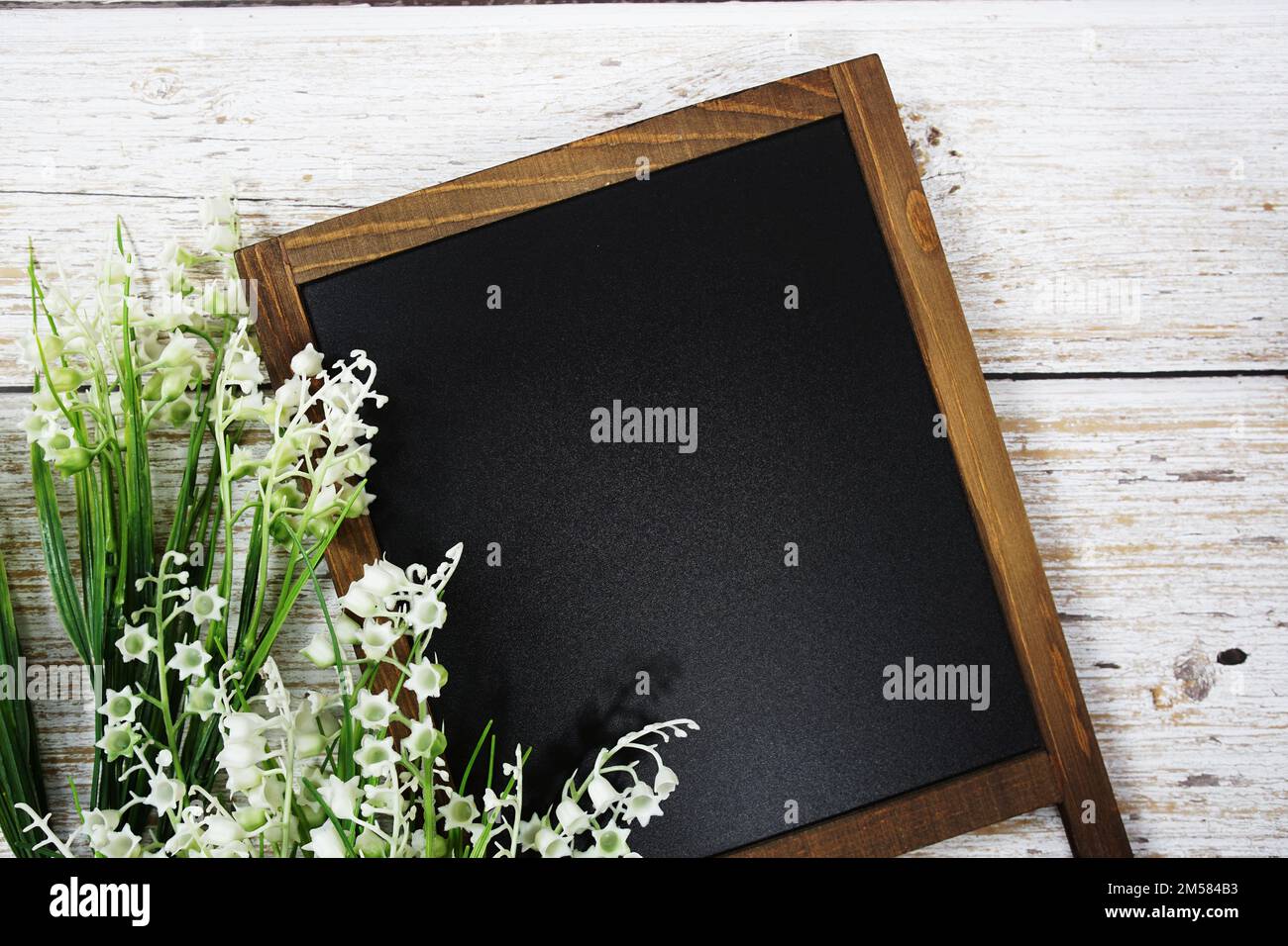 Empty Chalkboard mockup space for text message with flower decoration ...