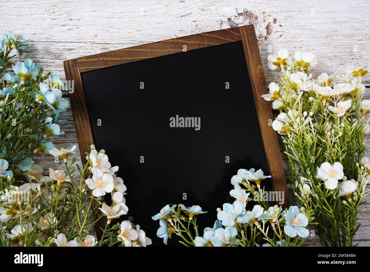 Empty Chalkboard mockup space for text message with flower decoration ...