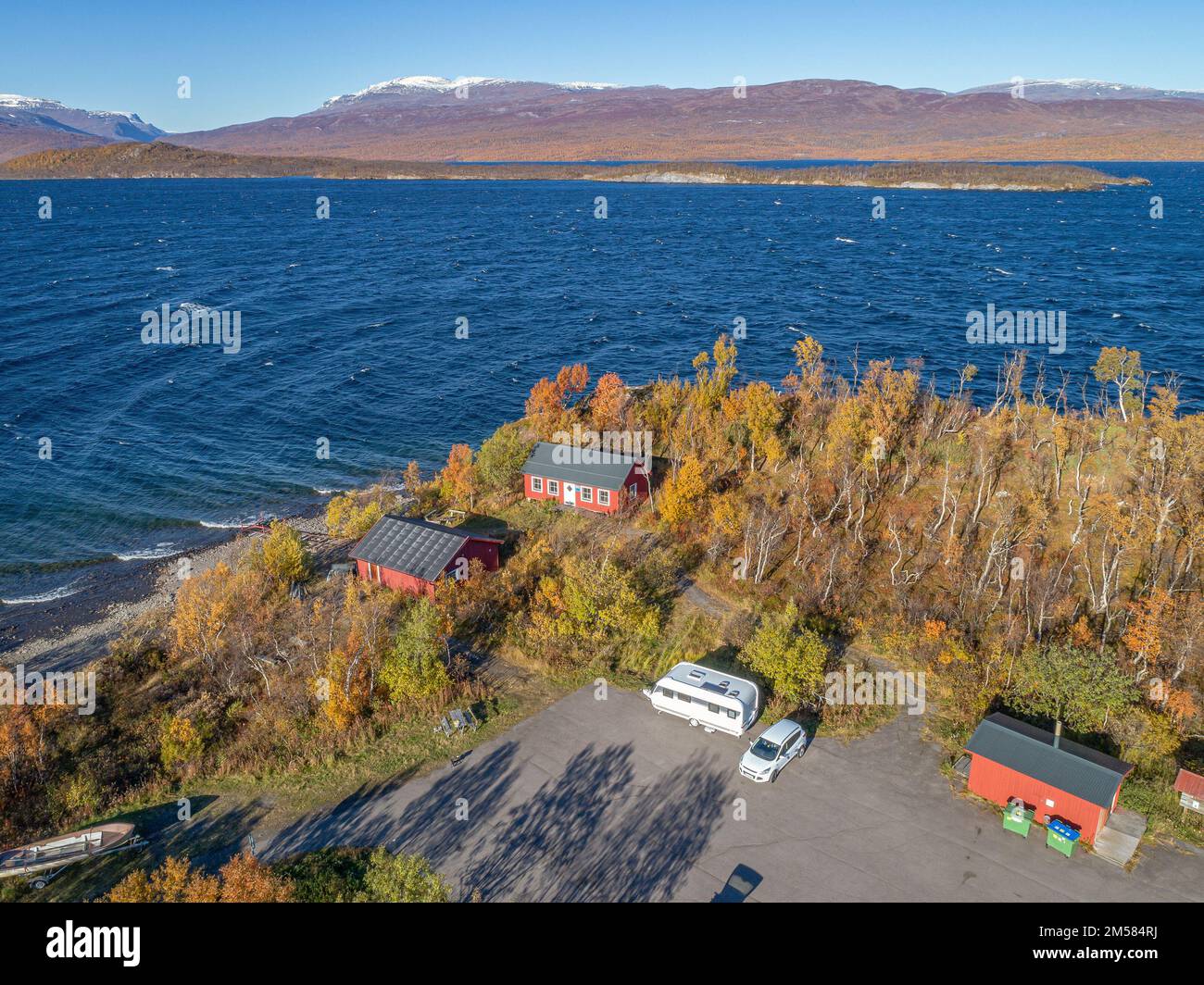 aerial footage Car Camping Caravan parking by lake from Abisko national ...