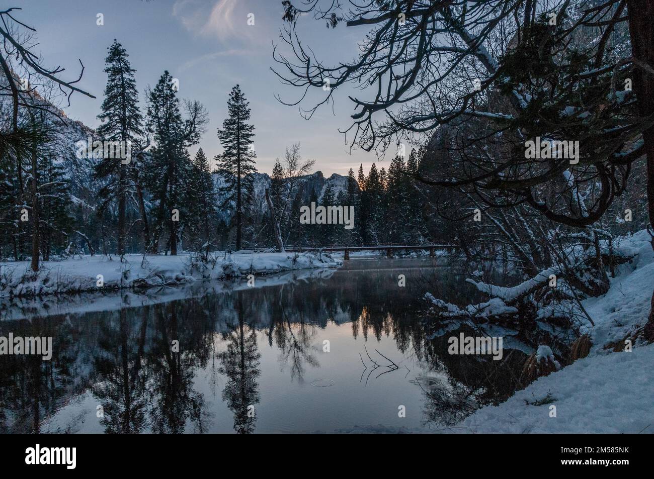 Exterior of a snow covered landscape surrounding the merced river in ...