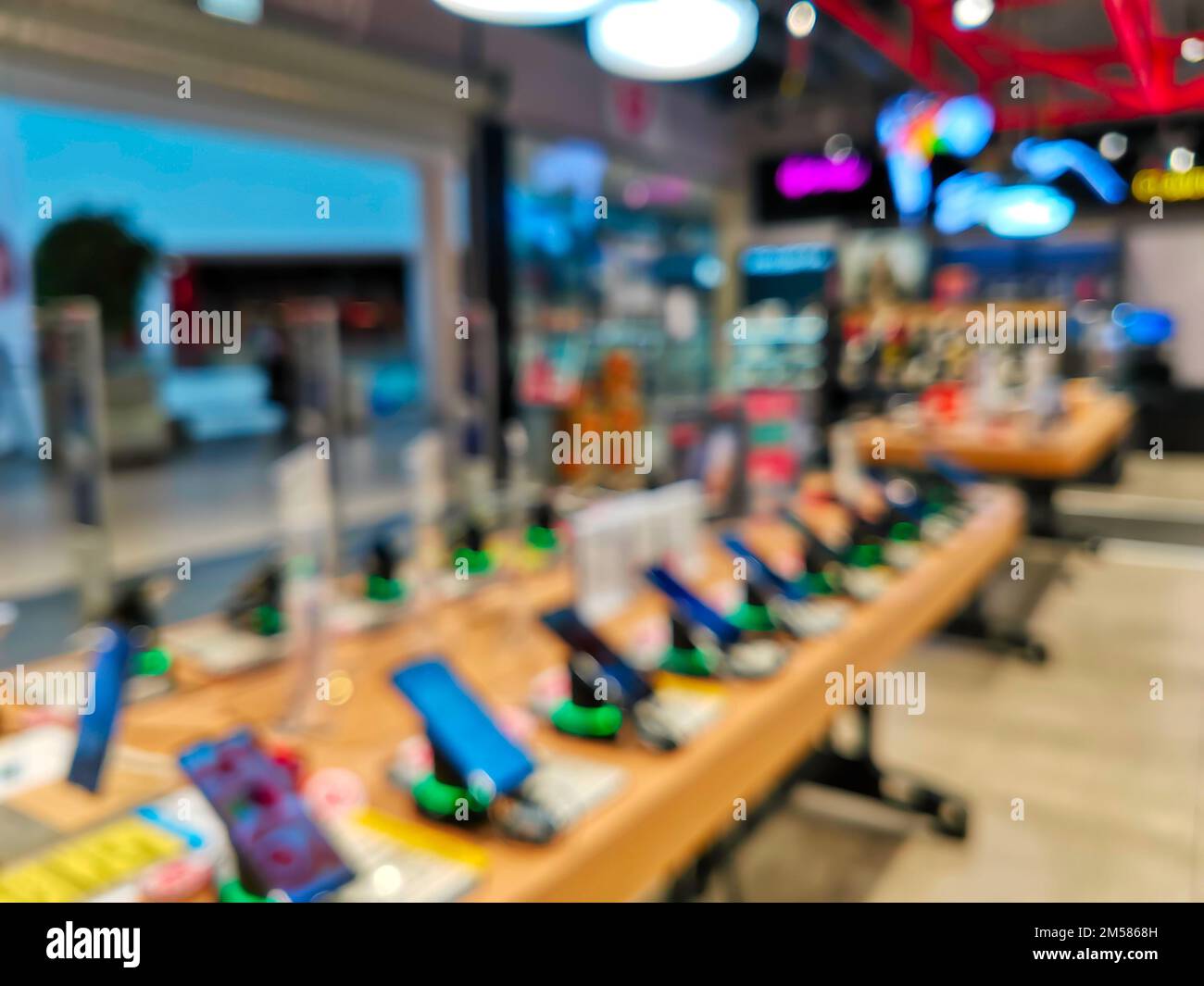 Showcase with smartphones in the modern electronics store. Buy a mobile ...