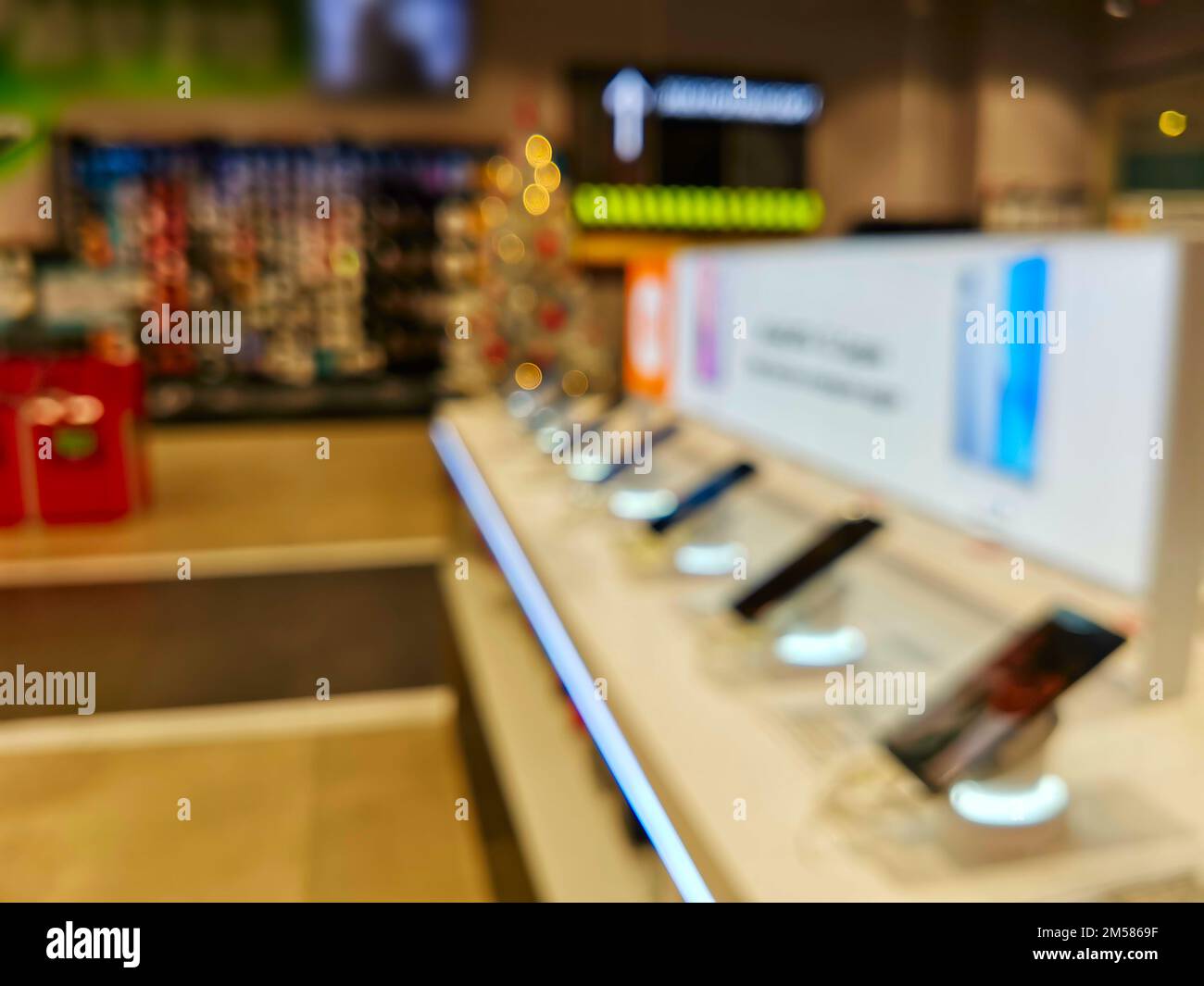 Showcase with smartphones in the modern electronics store. Buy a mobile ...
