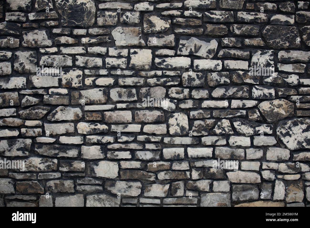 Very old gray natural limestone with dark color as a background for ...