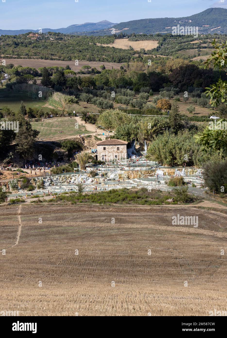 Saturnia, Italy - September 13, 2022: People are bathing in the hot ...