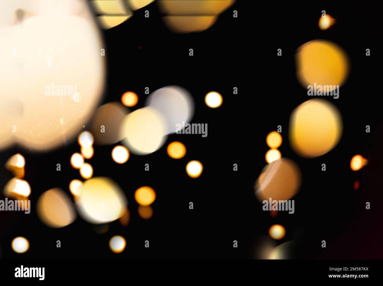 Blurry garland lights on a dark background. Festive Christmas and New ...