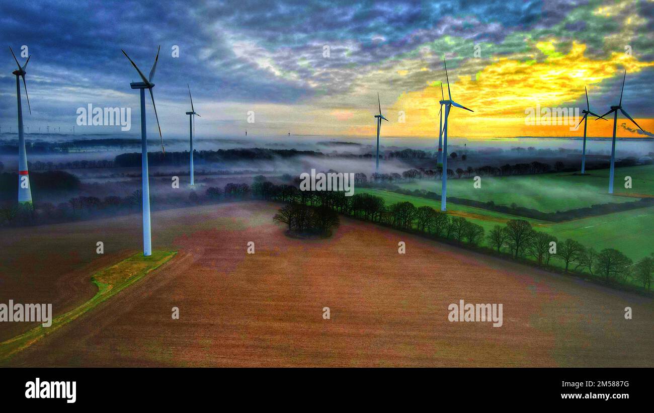 Industrial Windmills generating Wind energy on grass lawns under ...