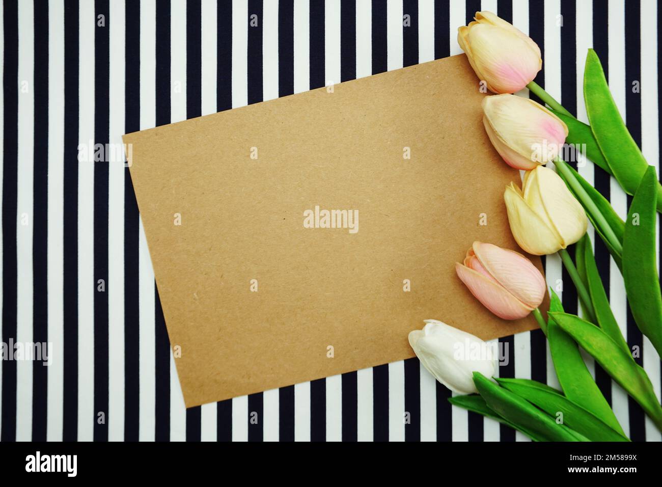 Empty paper craft with tulip flower bouquet Stock Photo - Alamy