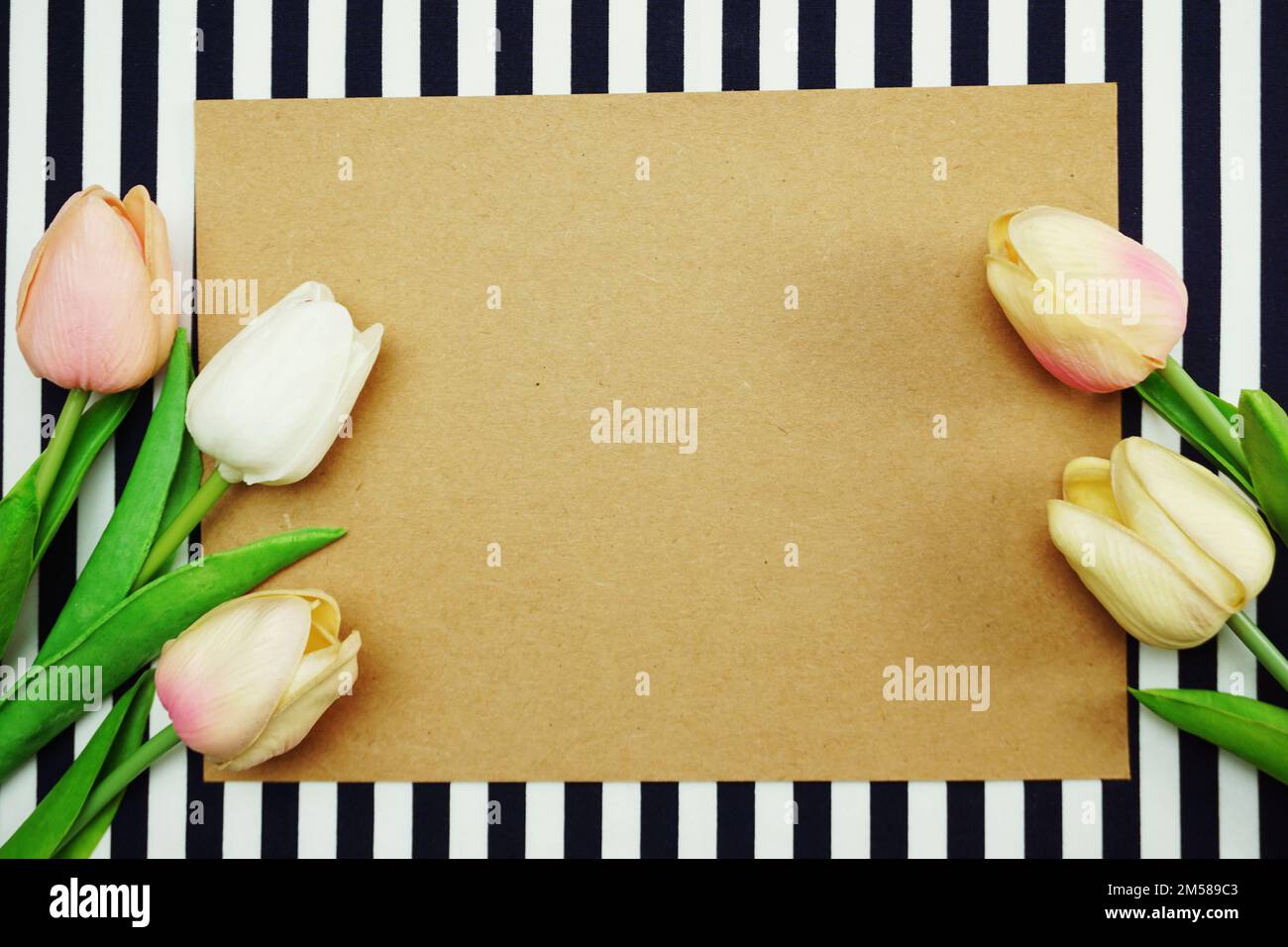 Empty paper craft with tulip flower bouquet Stock Photo - Alamy