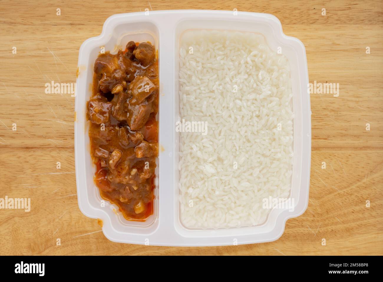 top view uncooked self cooking fast food of beef with potato and rice ...