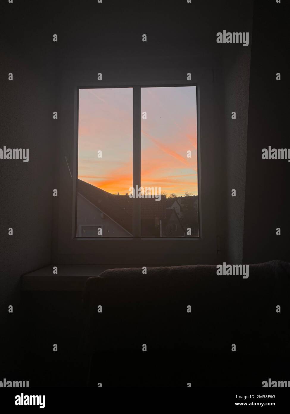 A beautiful view of sunset through a window Stock Photo - Alamy