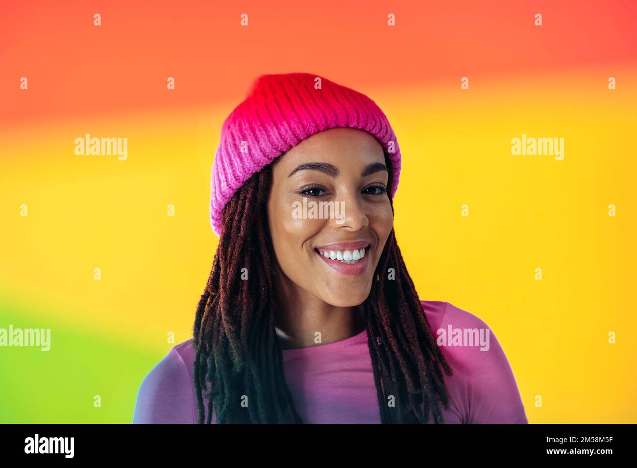 Image of a beautiful young woman posing on colored backgrounds wearing ...