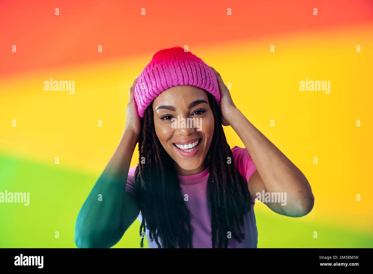 Image of a beautiful young woman posing on colored backgrounds wearing ...