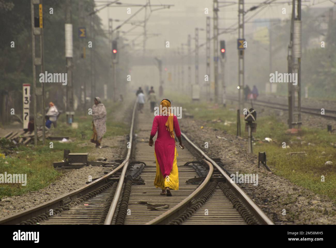 Guwahati, Guwahati, India. 27th Dec, 2022. A woman walk through the ...