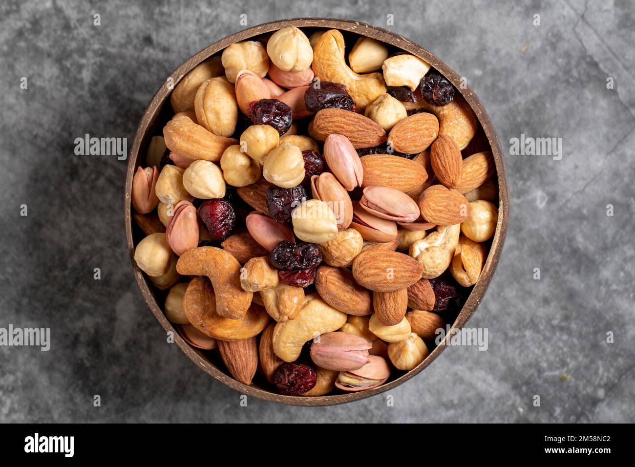 Mixed nuts in bowl on dark background. Nuts, cashews, almonds and ...