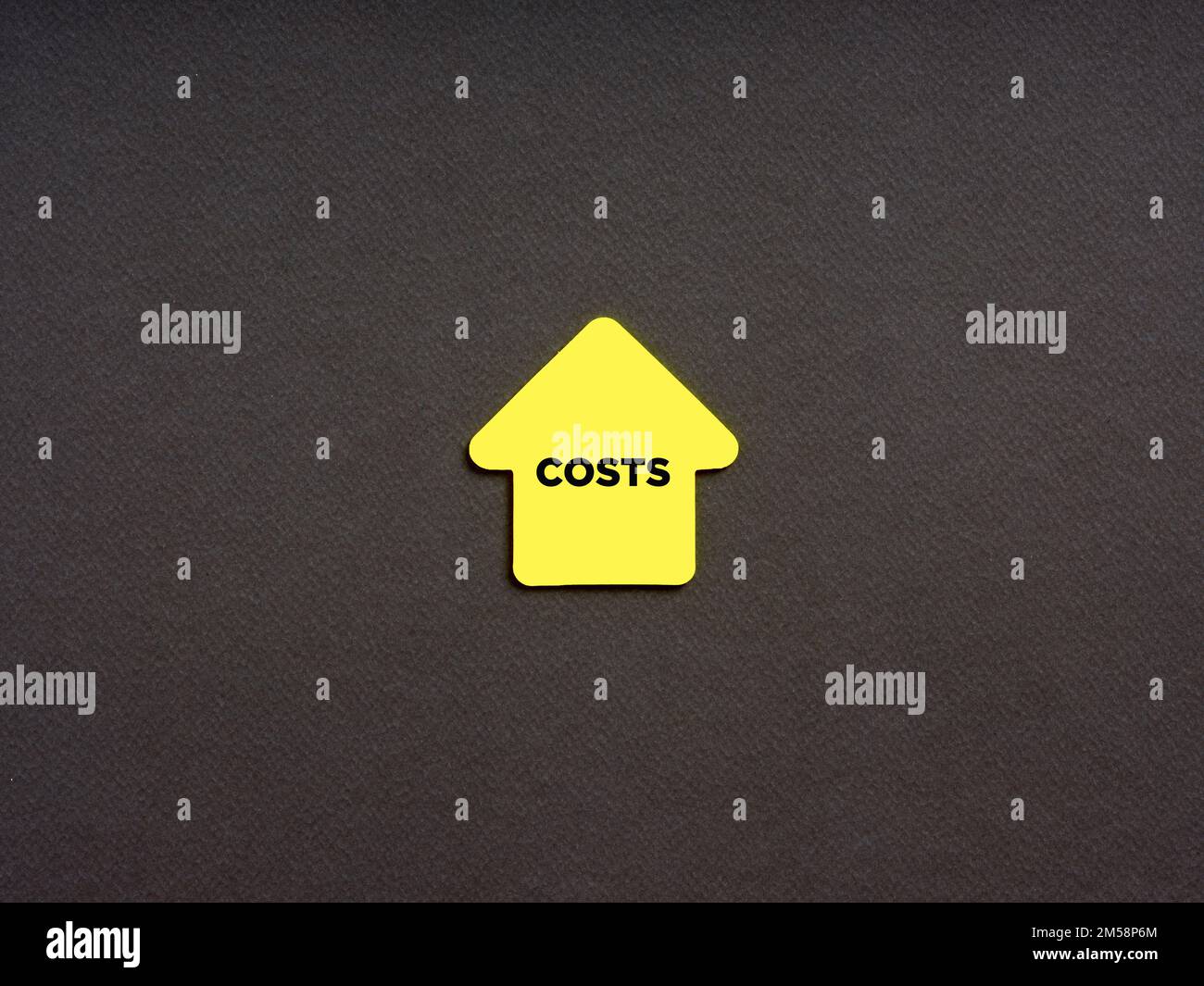 Increasing high costs in business and finance concept. The word cost on ...
