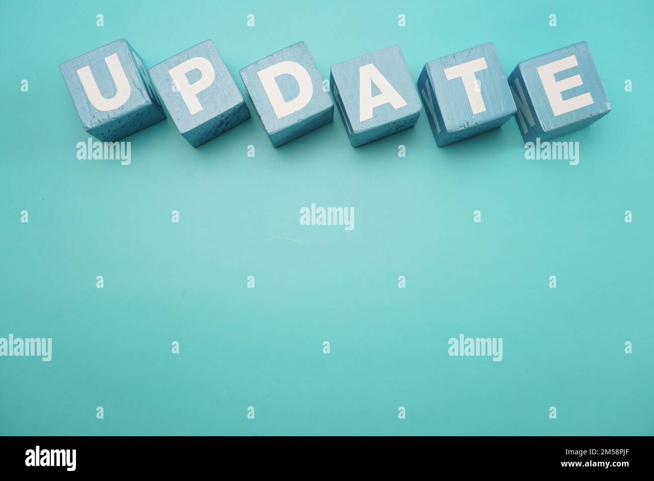 Update word created with cubes alphabet letters on blue background ...