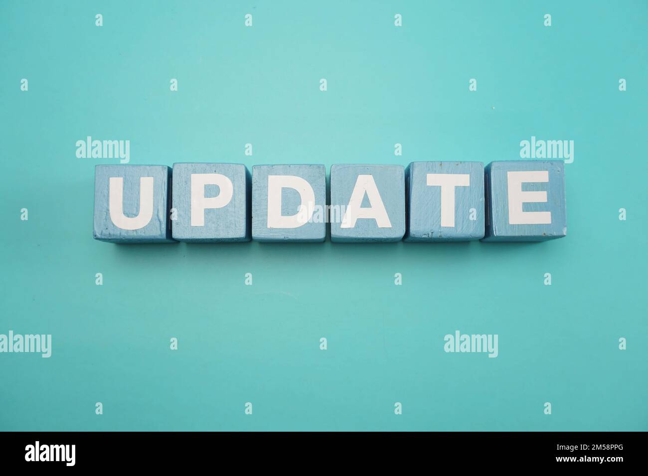 Update word created with cubes alphabet letters on blue background ...