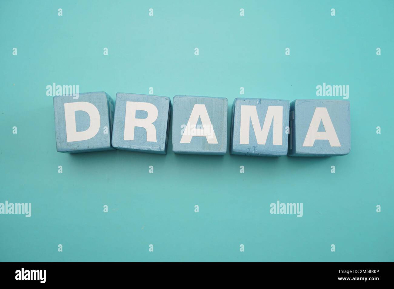 Drama word created with cubes alphabet letters on blue background Stock ...