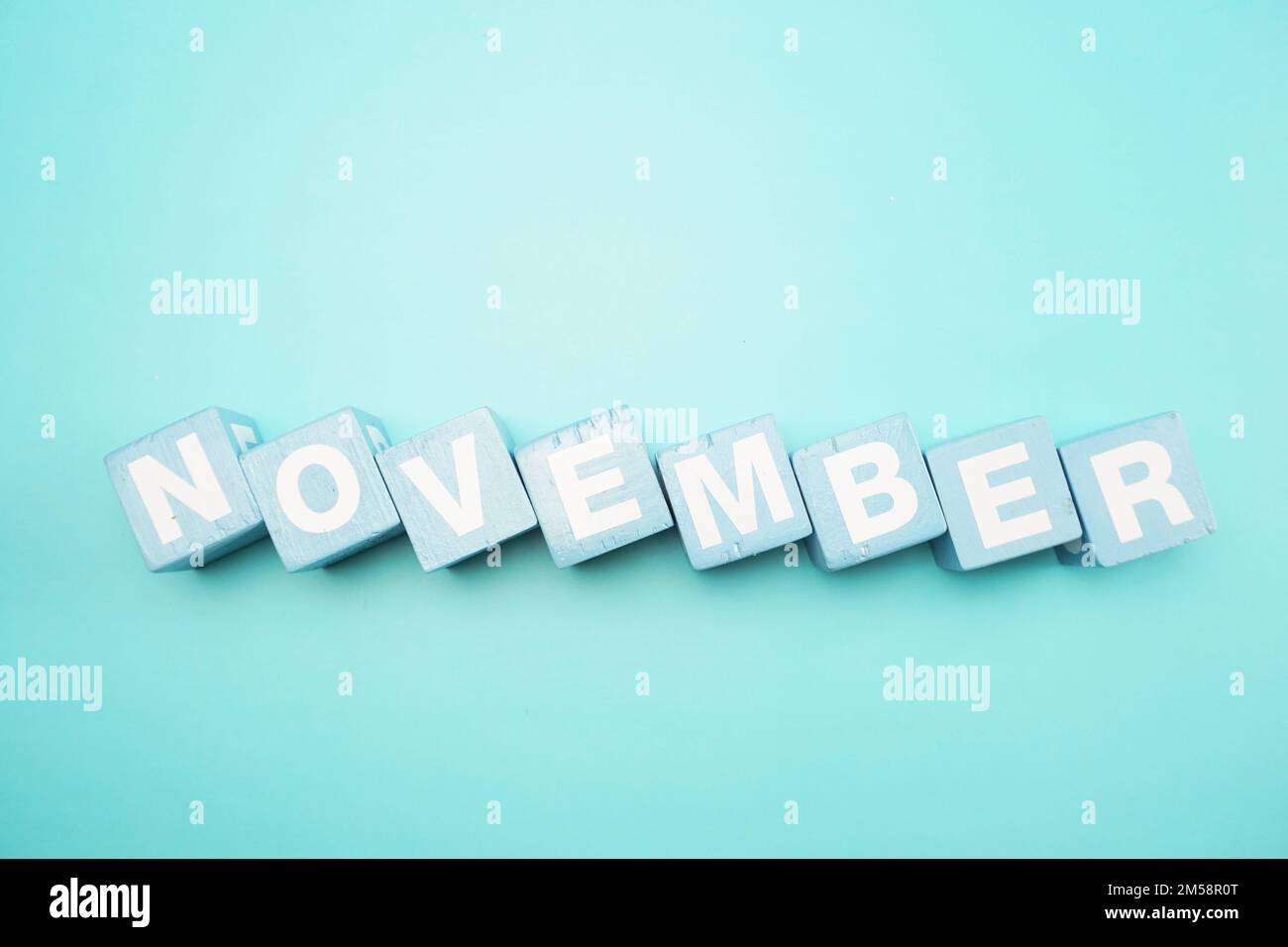 November alphabet letter on blu background Stock Photo - Alamy