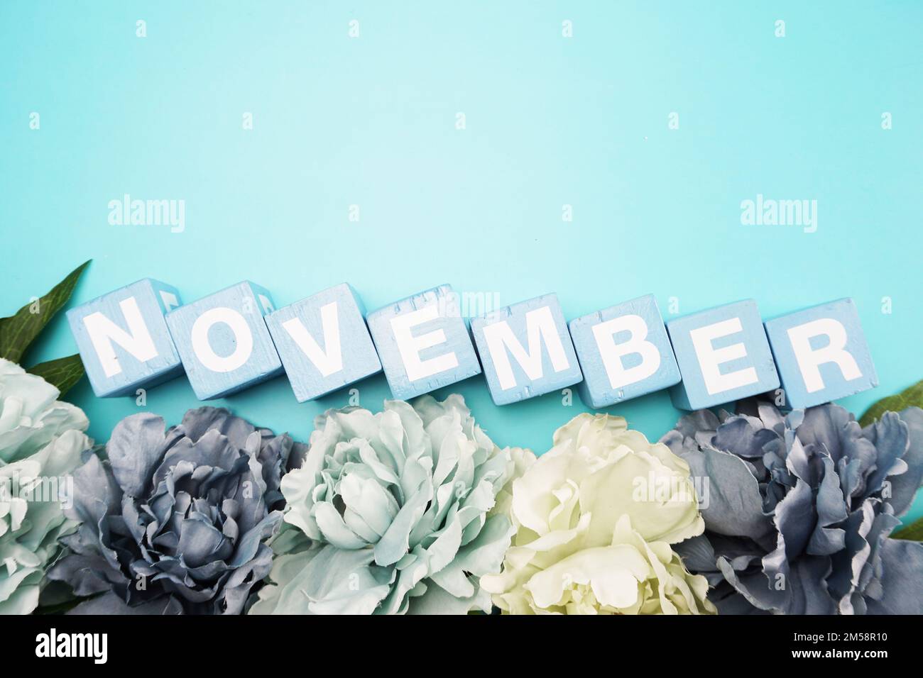 November alphabet letter with flower decoration on blu background Stock ...