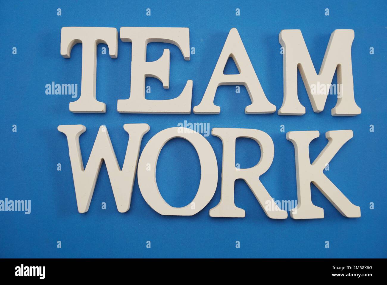teamwork text letters alphabet on blue background Stock Photo - Alamy