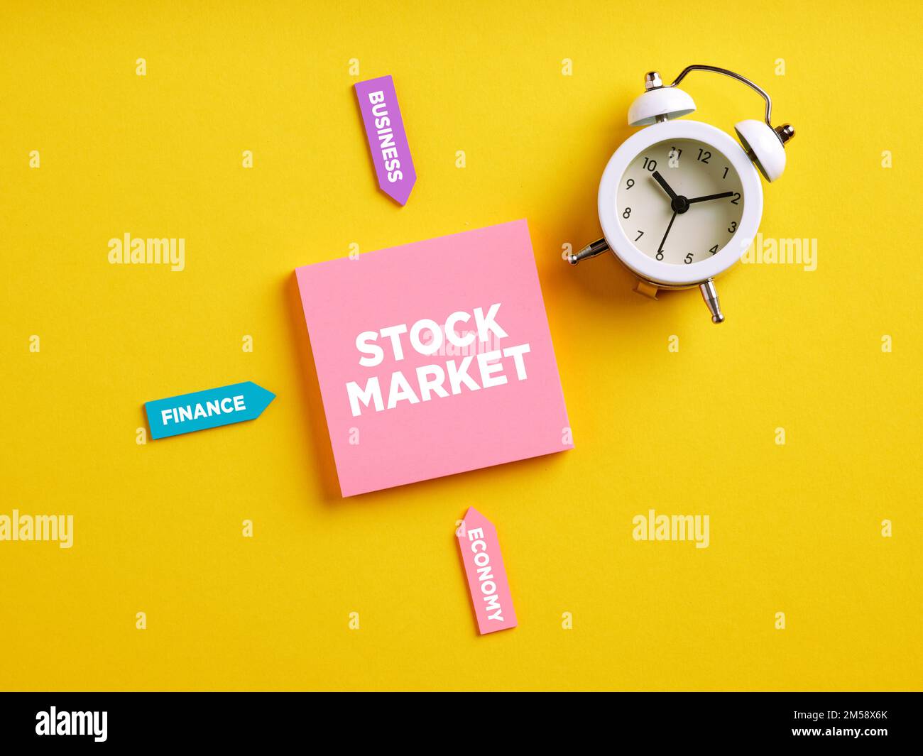 The word stock market on pink note paper. Determinants of stock market ...