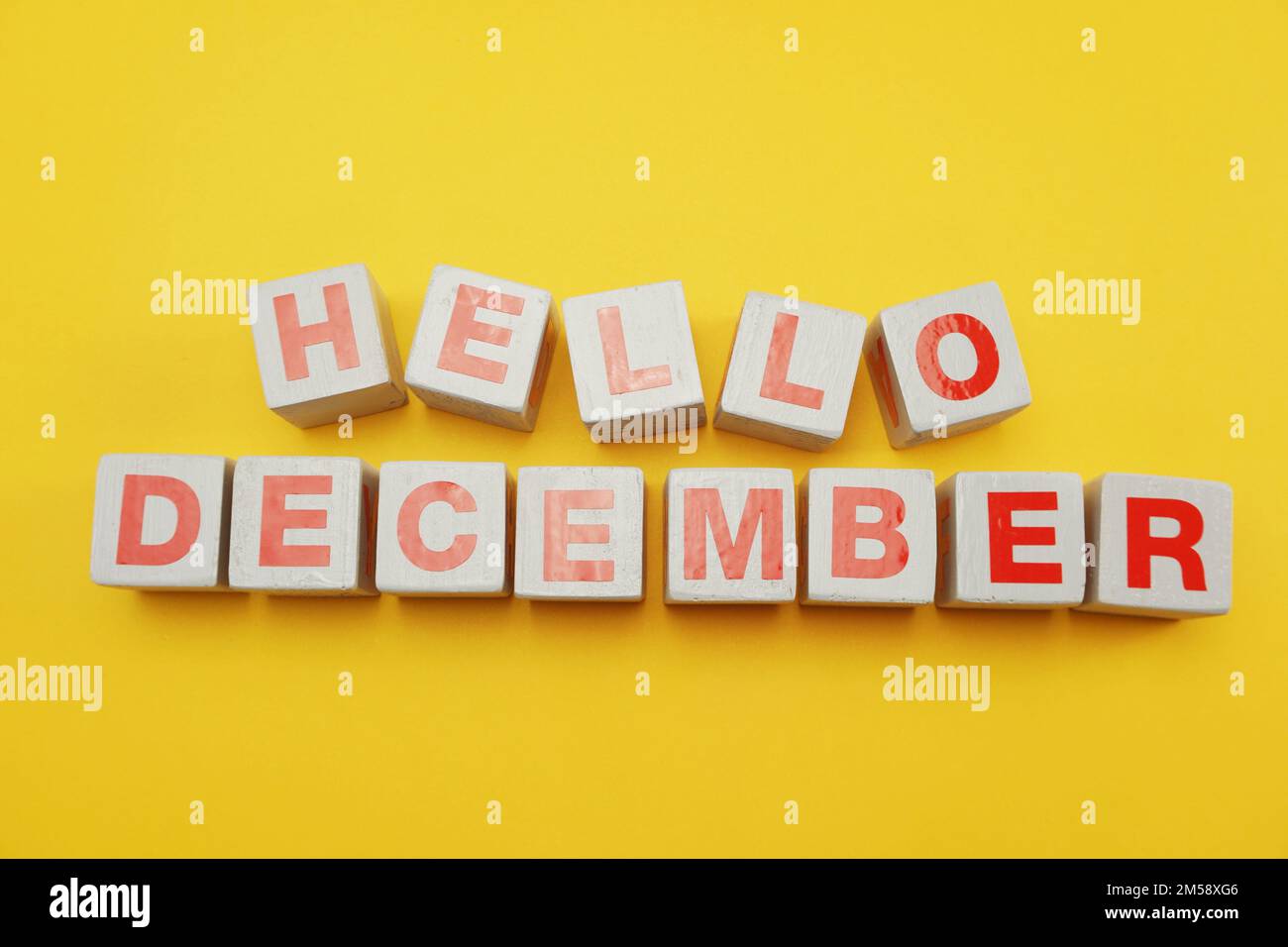 Hello December alphabet letters on yellow background Stock Photo - Alamy