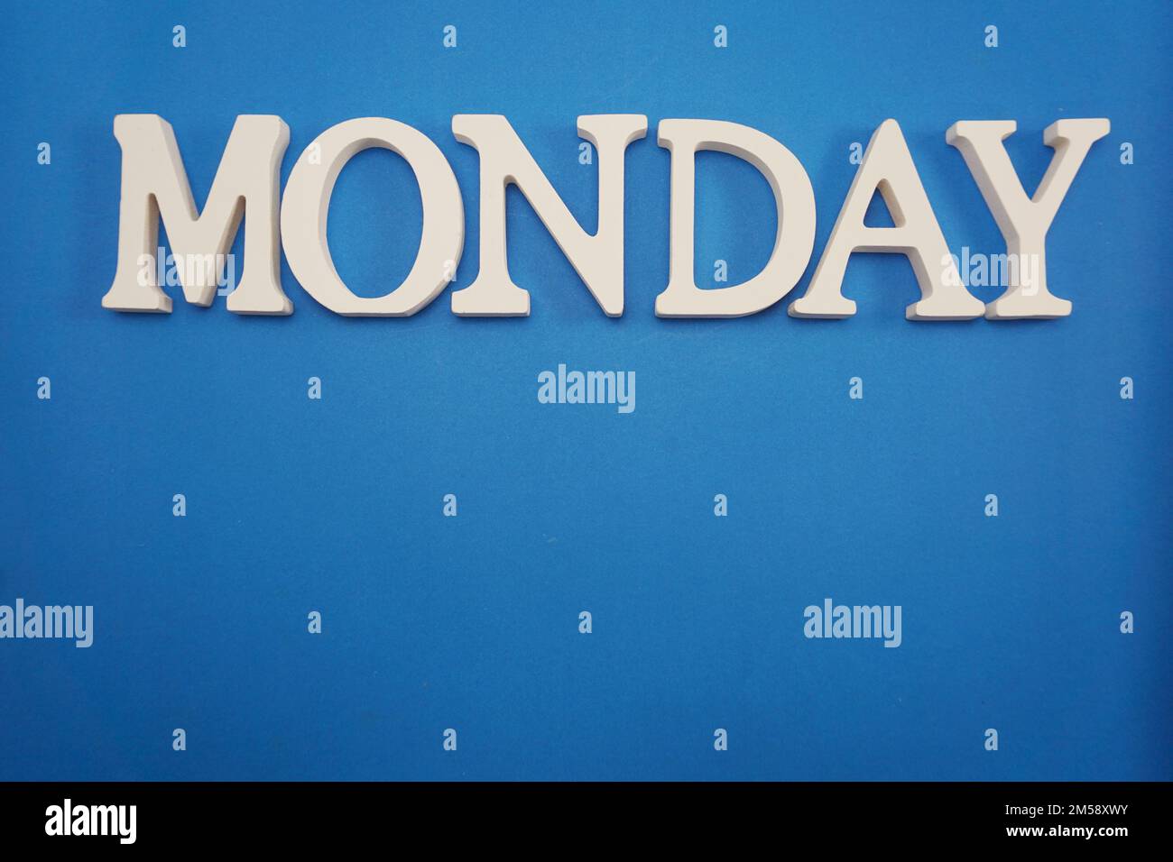 Monday alphabet letters with space copy on blue background Stock Photo ...